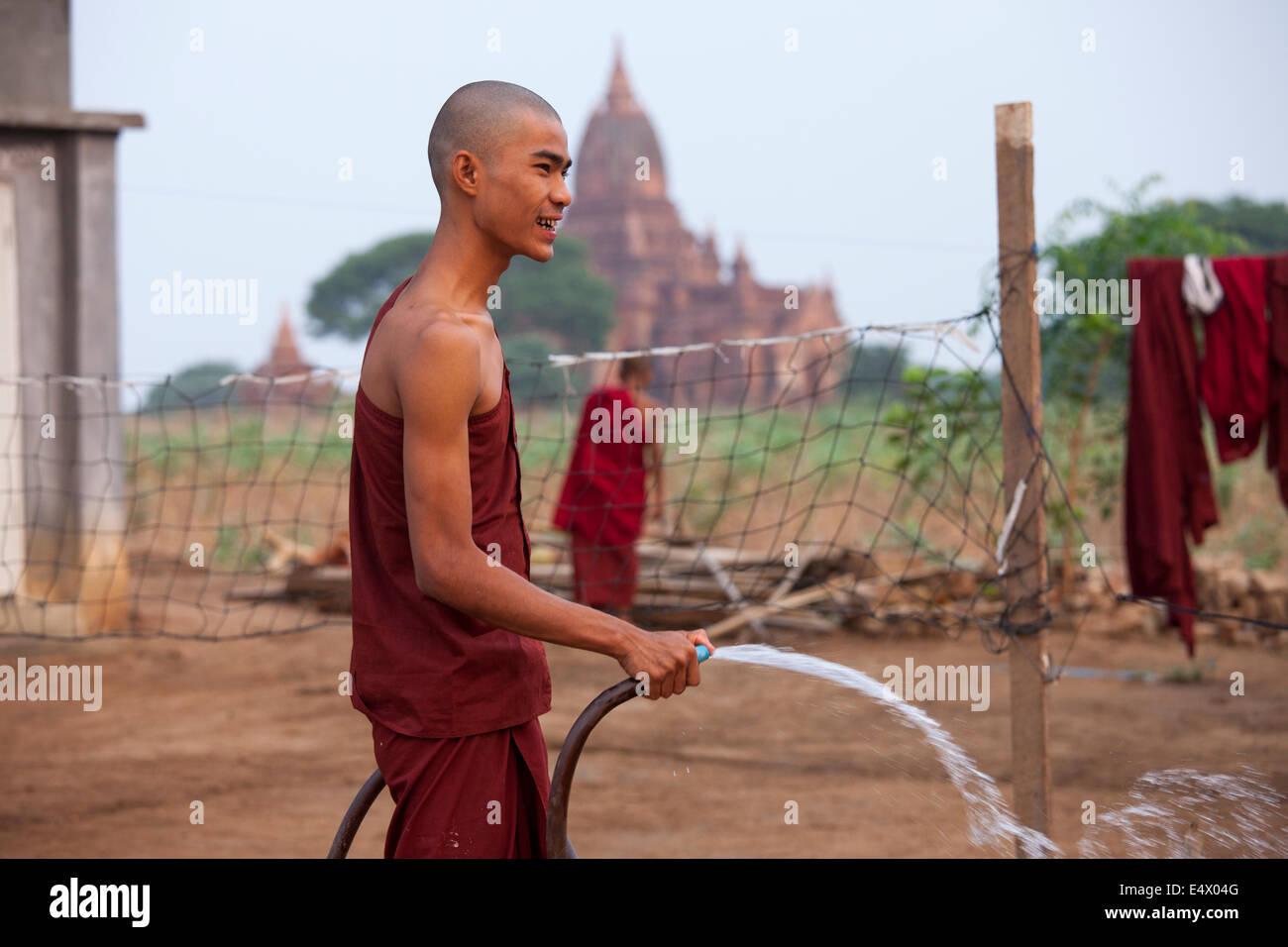 Buddhist monks cleaning temple hi-res stock photography and images - Alamy