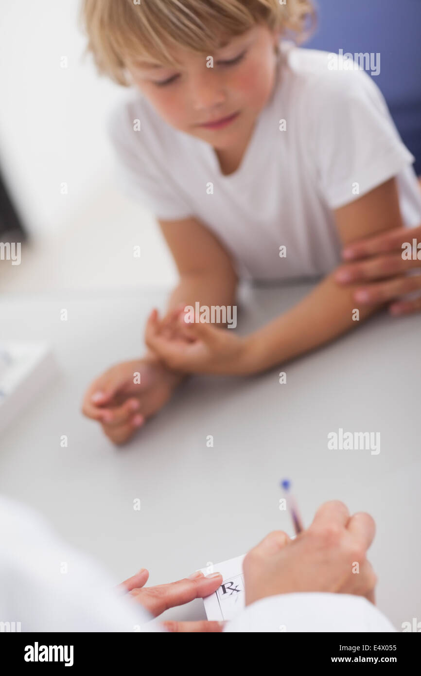 Child looking at a paper Stock Photo - Alamy