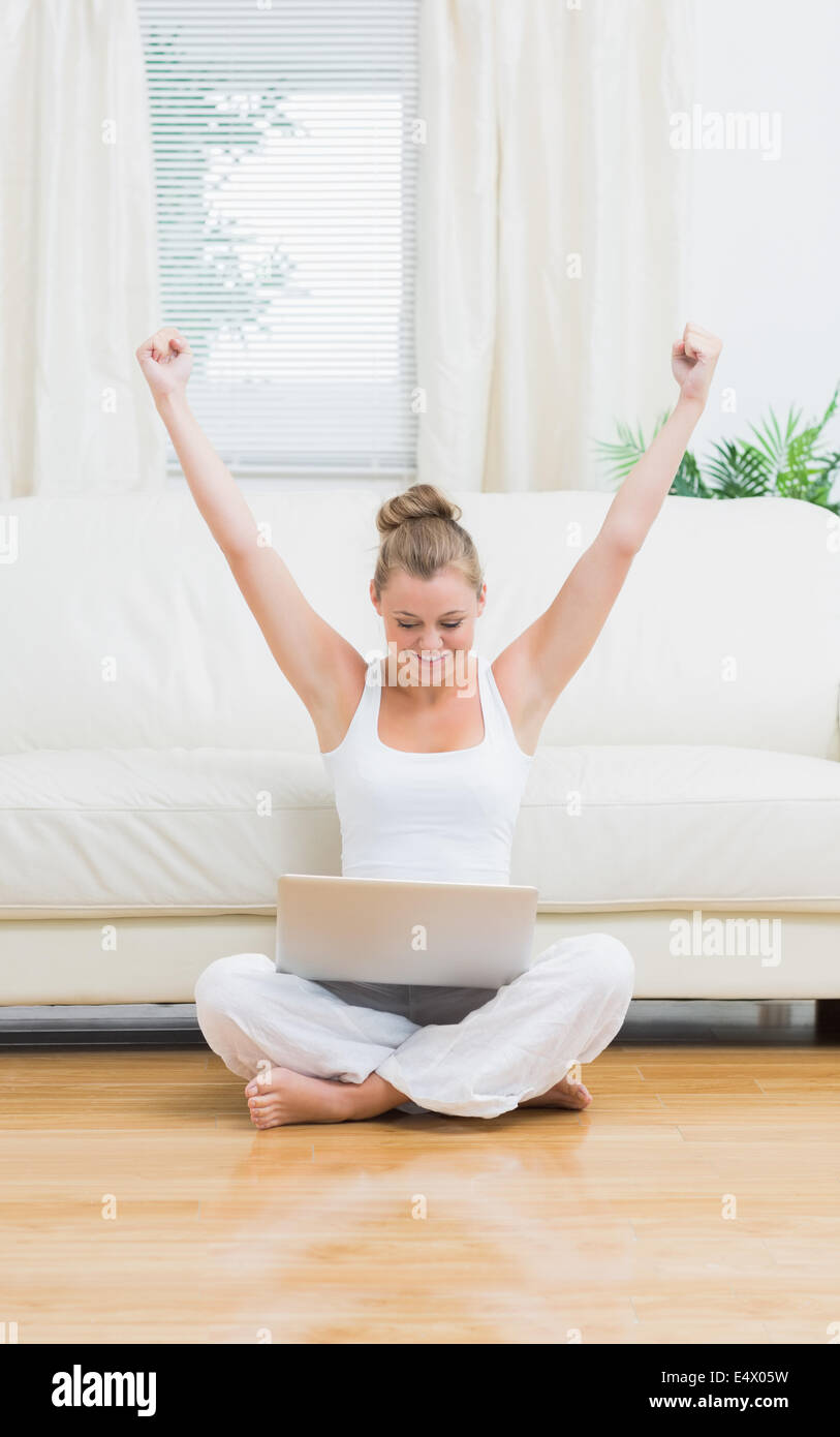 Woman having success while using internet Stock Photo - Alamy