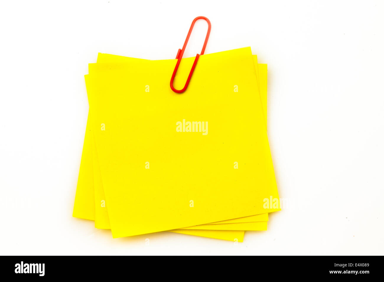 Sticky note with red paperclip Stock Photo - Alamy