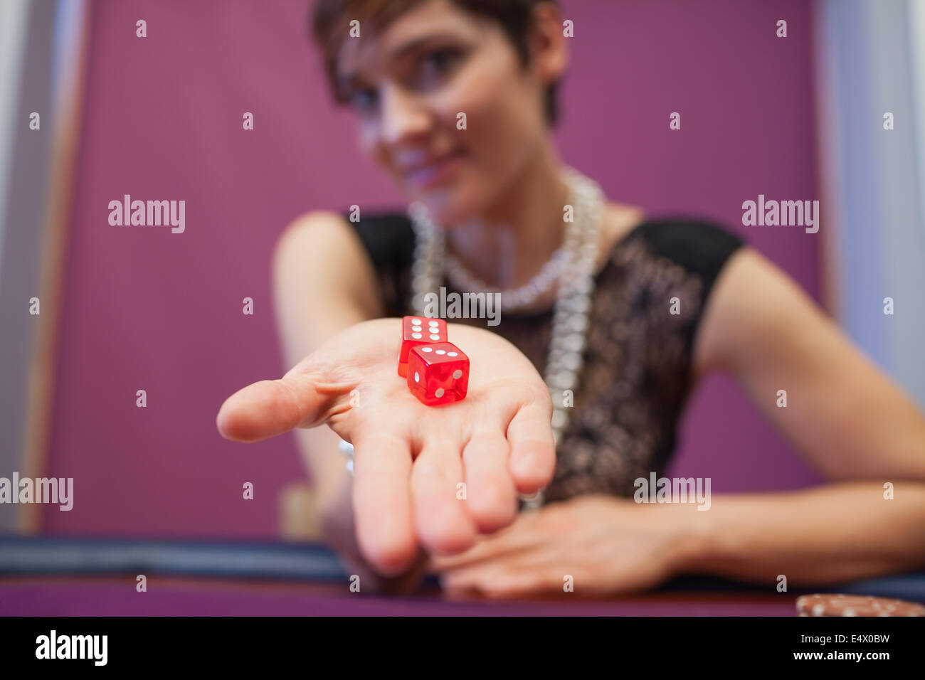 Woman holding dice hi-res stock photography and images - Alamy