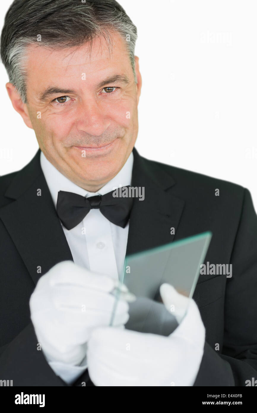 Happy waiter writing on virtual screen Stock Photo - Alamy