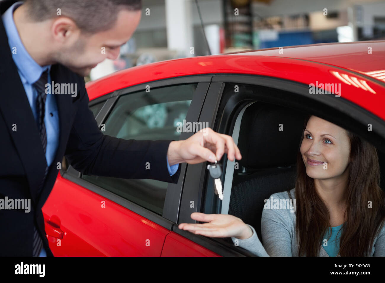 Customer receiving car keys Stock Photo - Alamy
