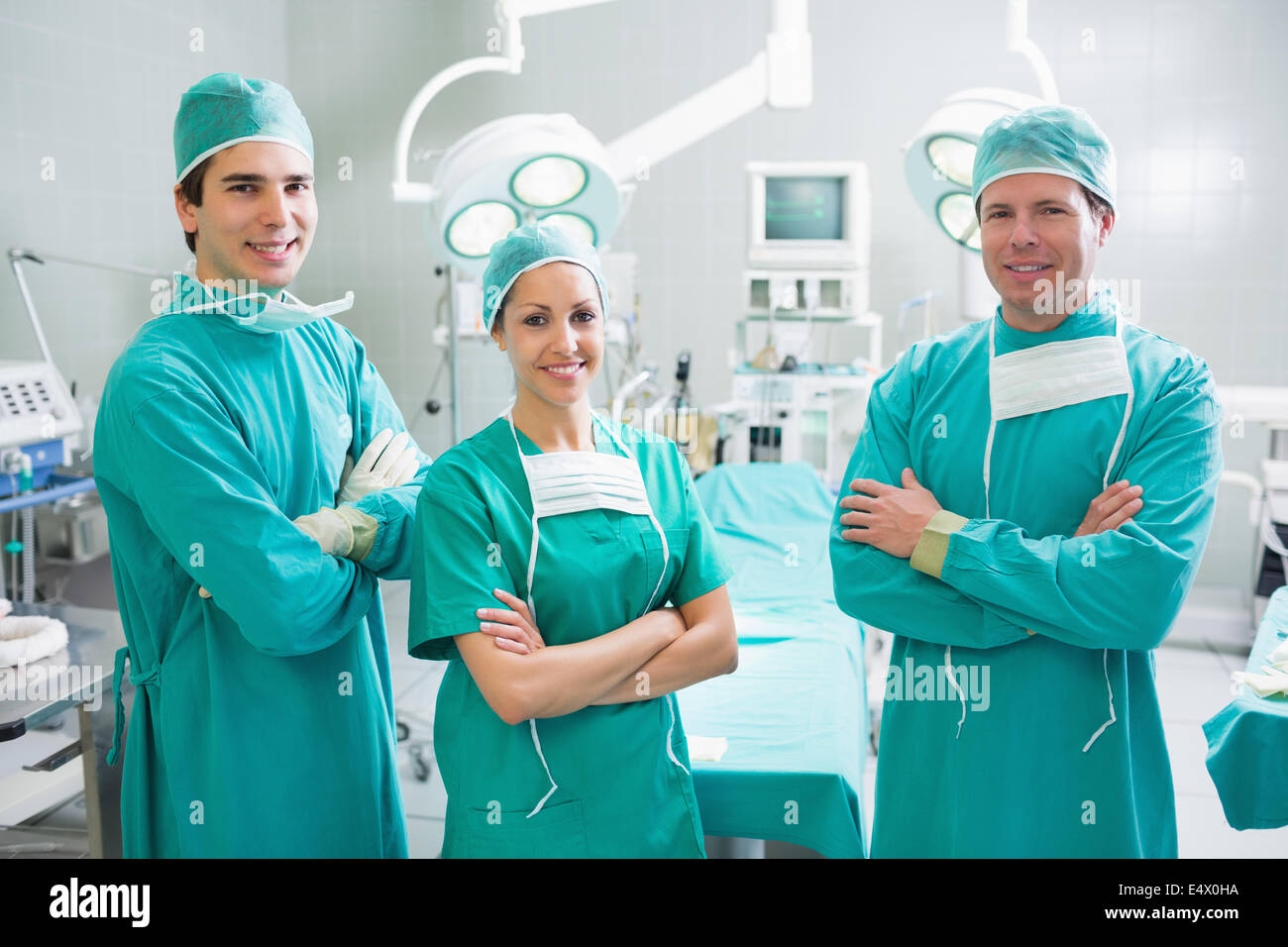 Surgeons standing up with arms crossed Stock Photo - Alamy