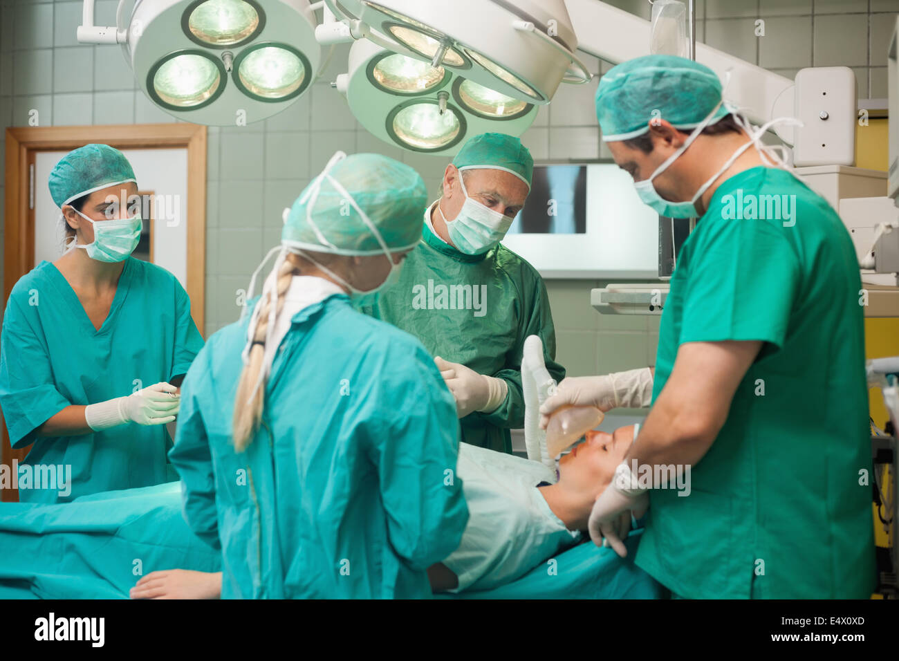 Surgery team working together Stock Photo - Alamy