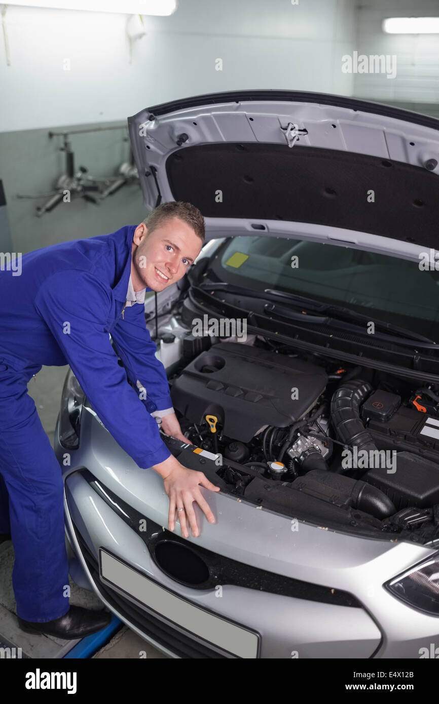Mechanic repairing a car engine Stock Photo - Alamy