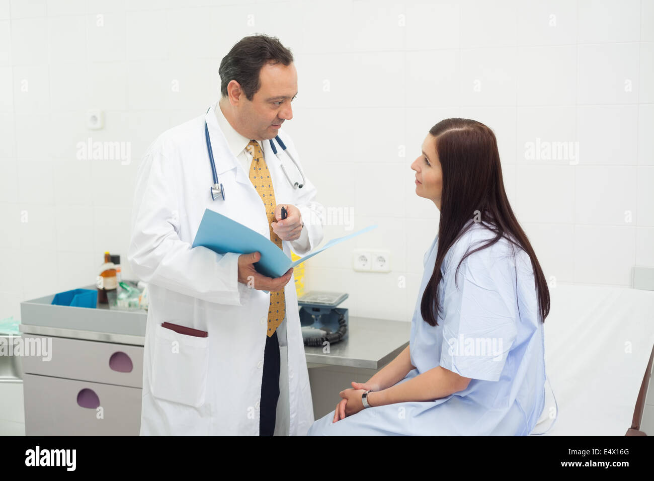 Patient listening to a doctor Stock Photo - Alamy