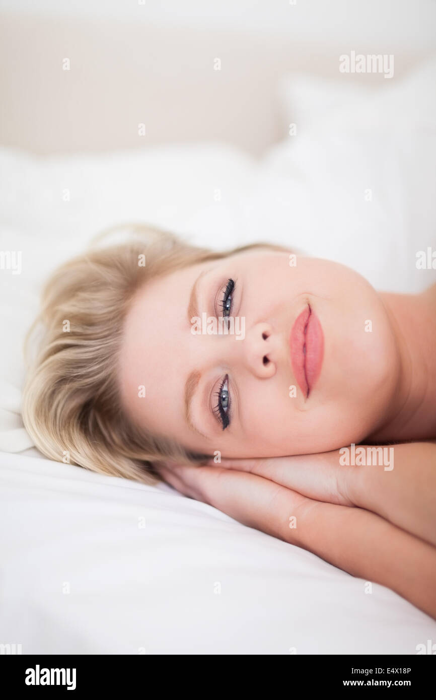 Young woman smiling while she is drowsy Stock Photo - Alamy