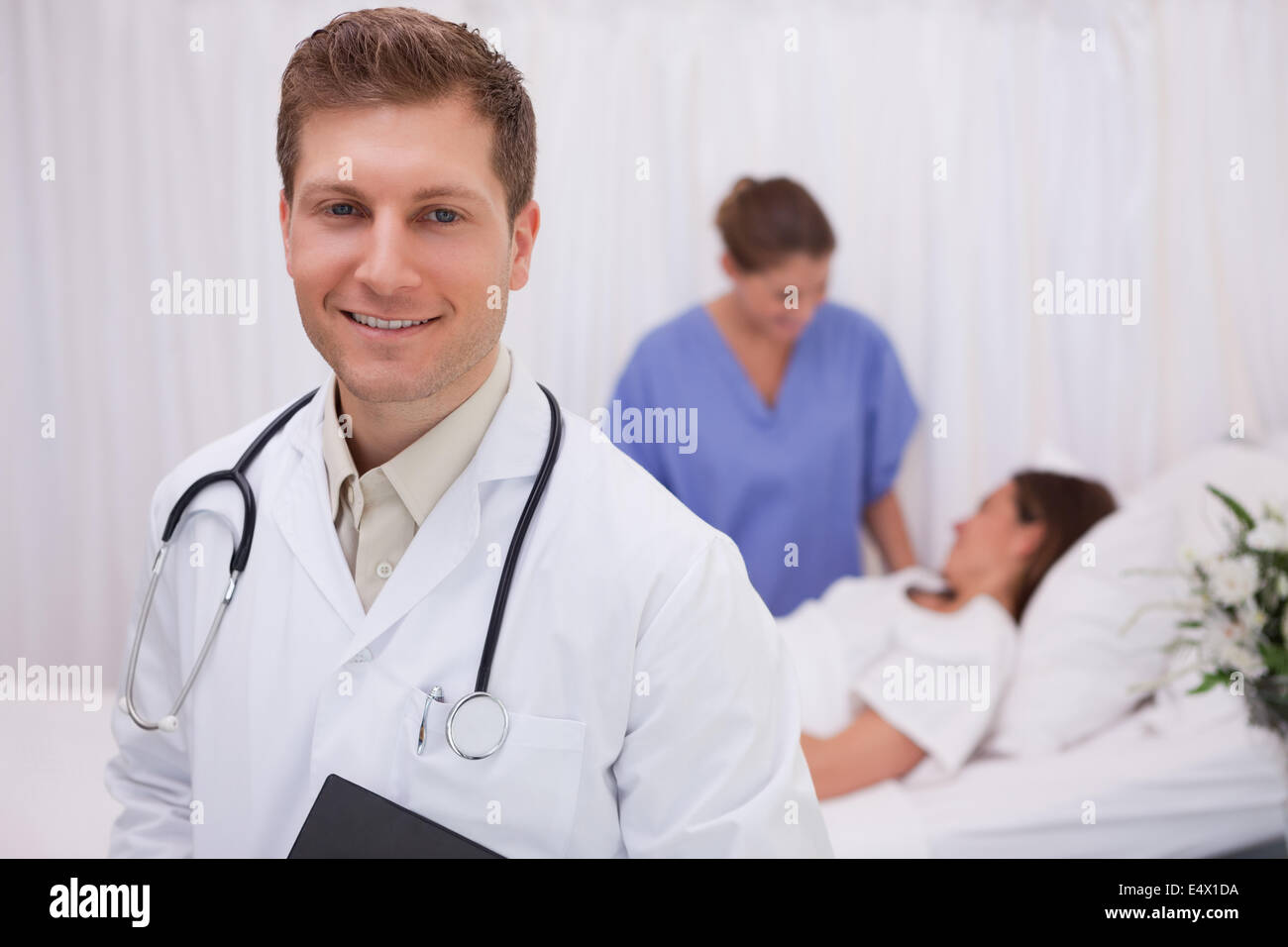 Doctor standing in patients room hi-res stock photography and images ...
