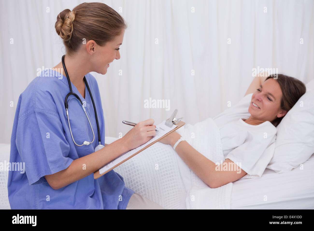 Surgeon questioning patient Stock Photo - Alamy