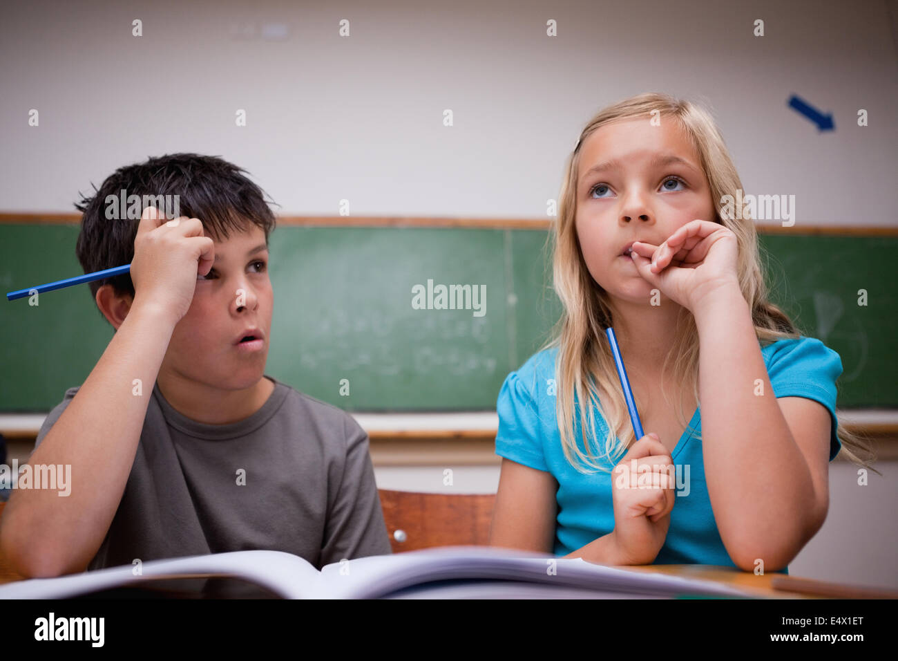 Thoughtful children working together Stock Photo - Alamy