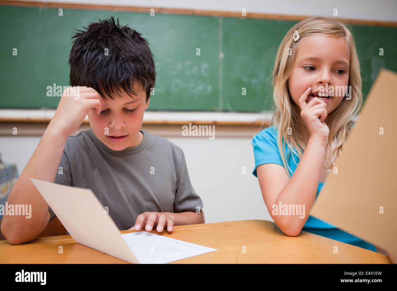Two children reading classroom together hi-res stock photography and ...