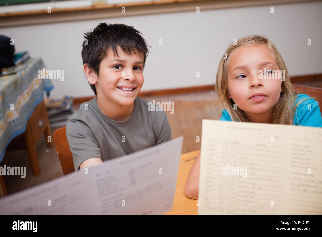 Pupils receiving their school report Stock Photo - Alamy