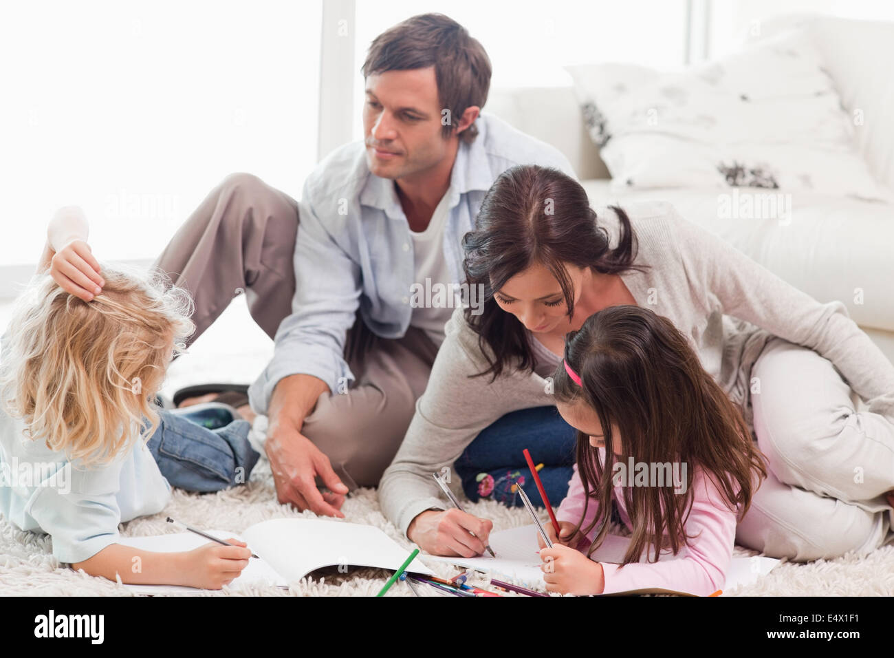 Family drawing together Stock Photo - Alamy