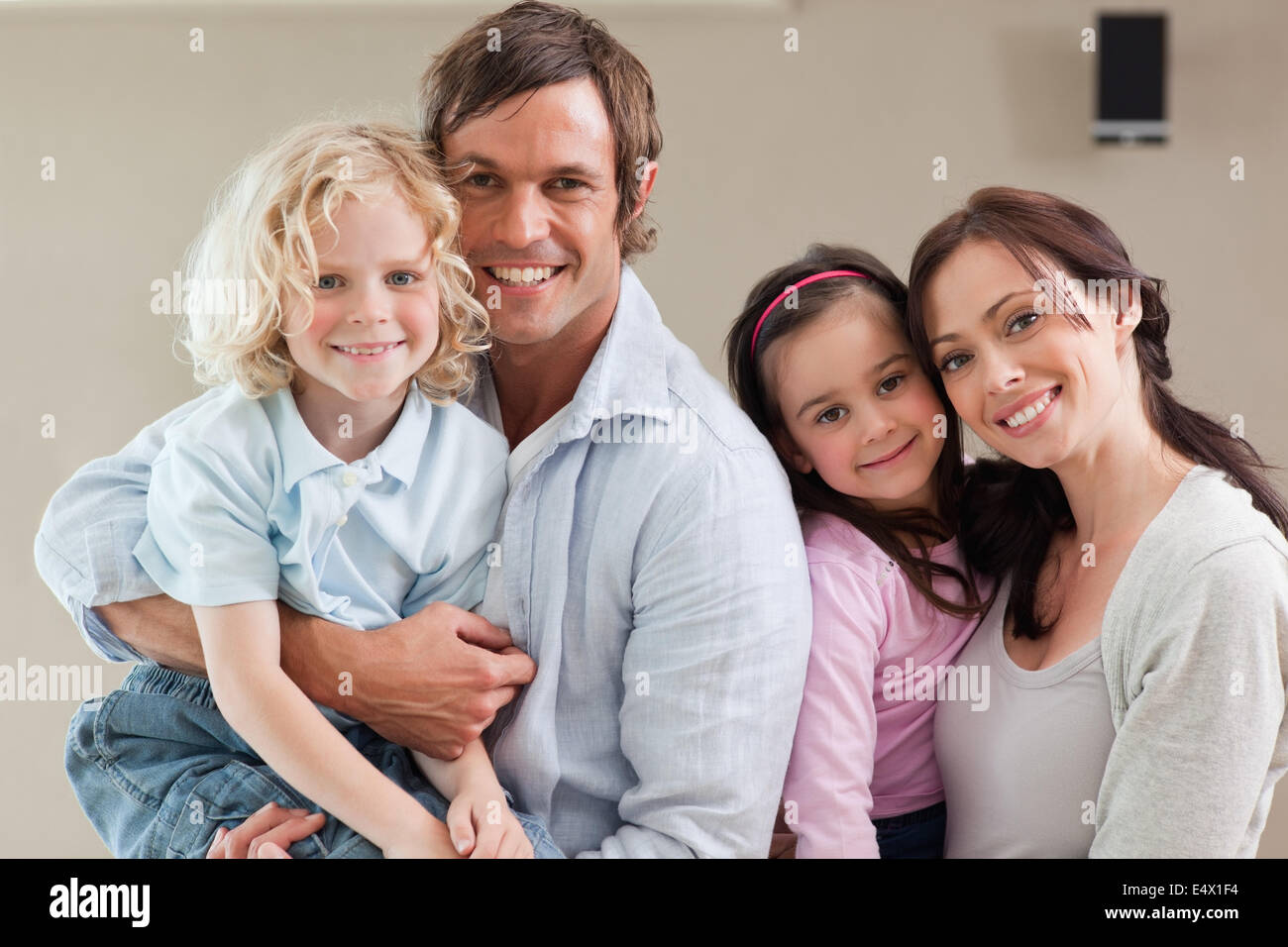 Lovely family posing together Stock Photo - Alamy