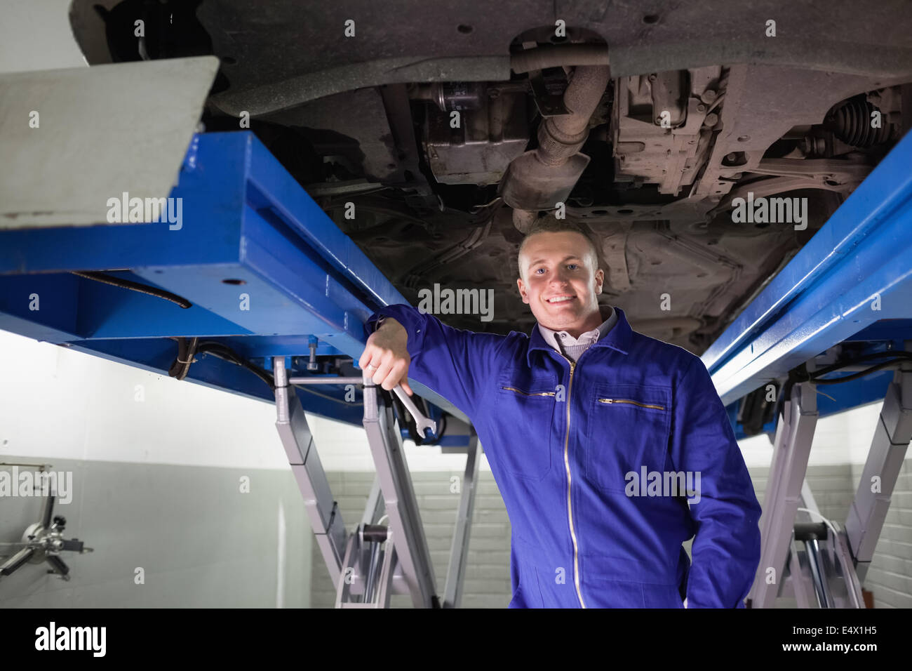 Mechanic leaning on machine hi-res stock photography and images - Alamy