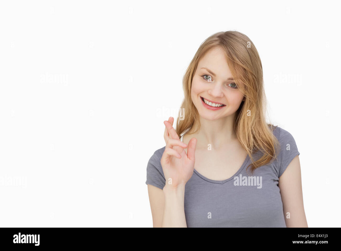 Blonde woman crossed fingers looking hi-res stock photography and ...