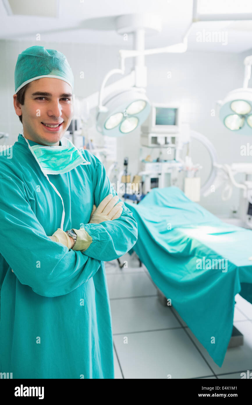 Surgeon with arms crossed smiling Stock Photo - Alamy