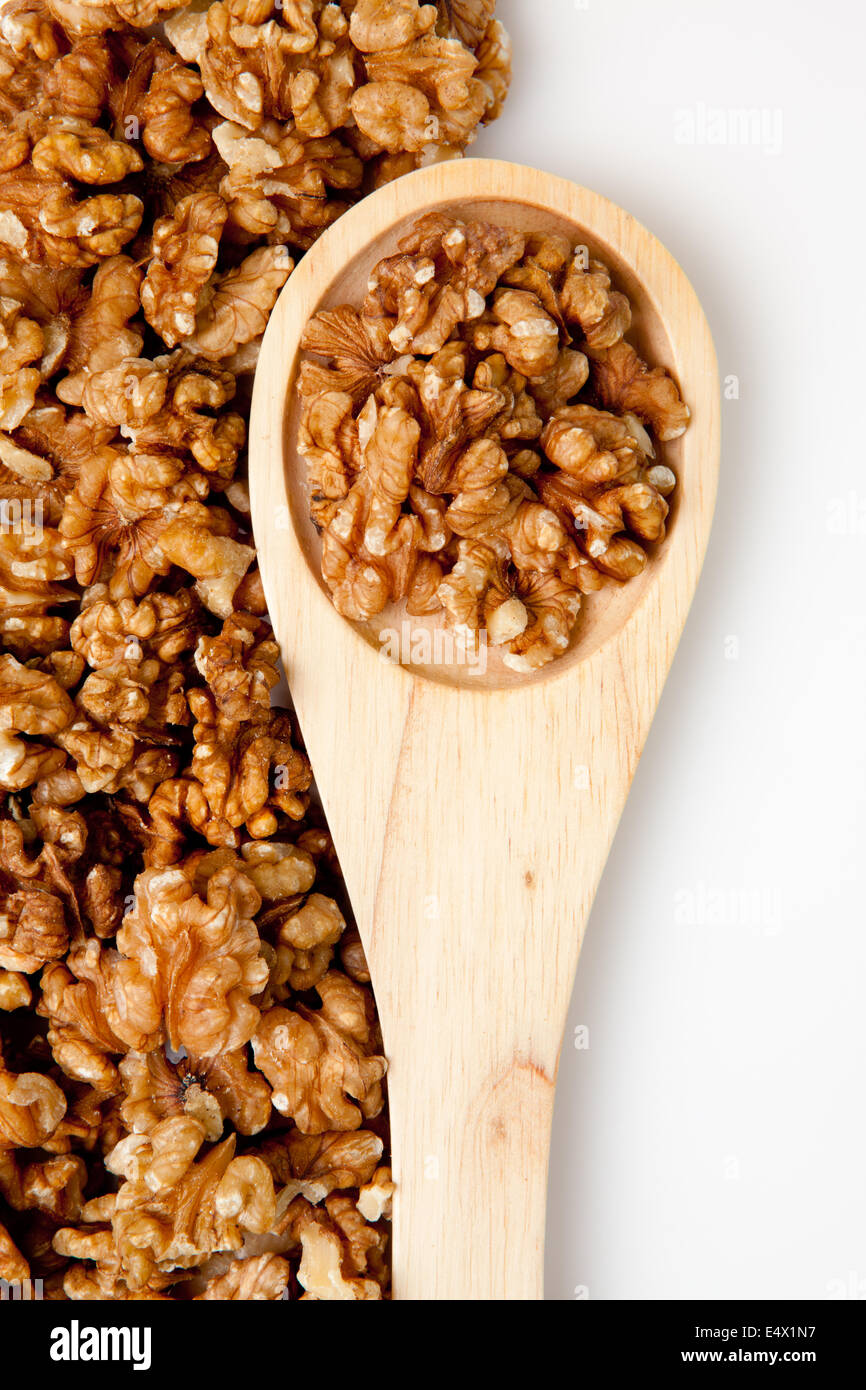 Wooden spoon with nuts Stock Photo - Alamy