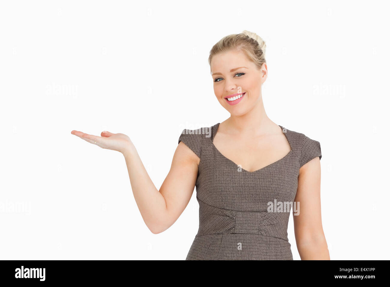Woman presenting something with her hand Stock Photo - Alamy