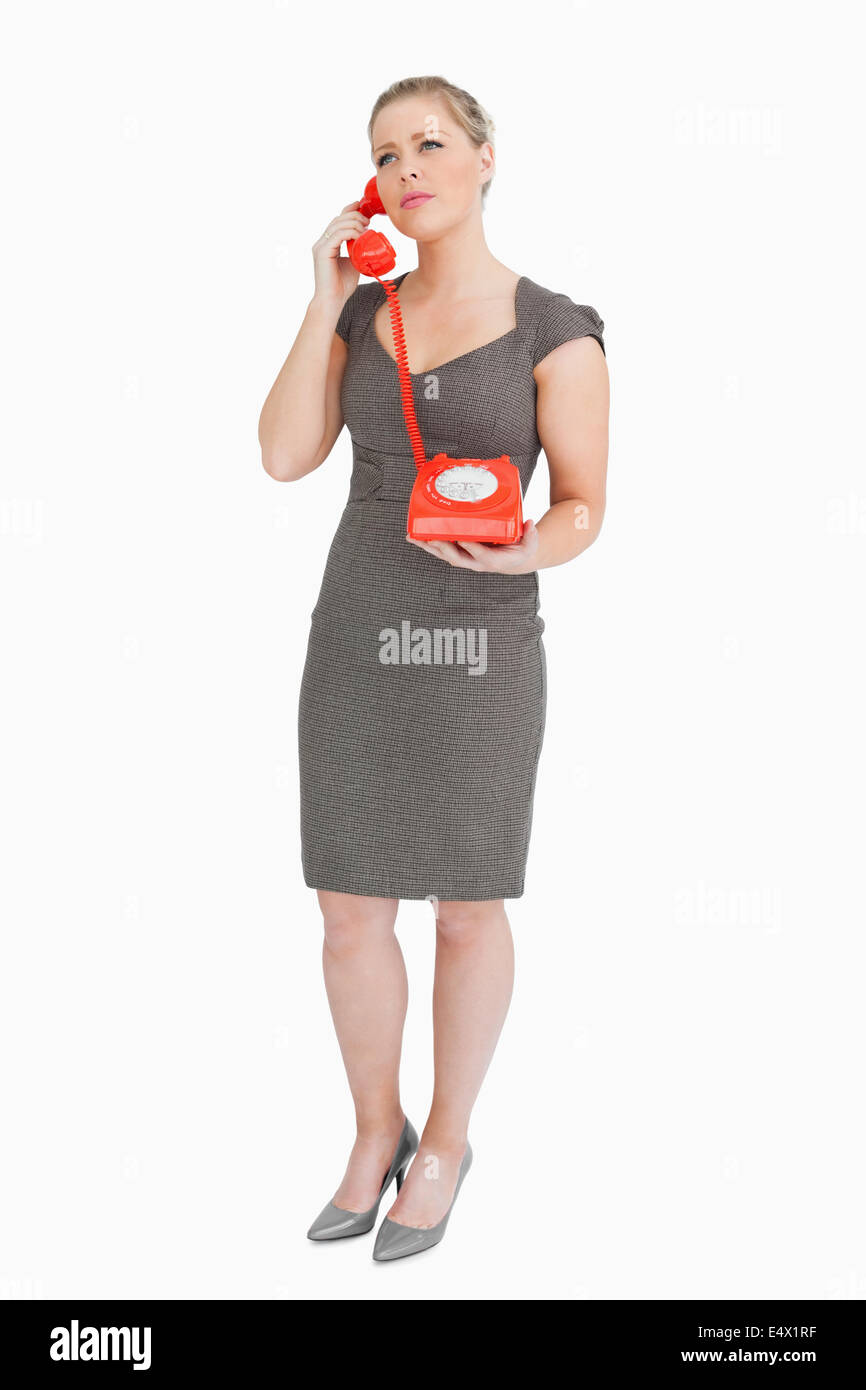Woman calling someone with a retro phone Stock Photo - Alamy