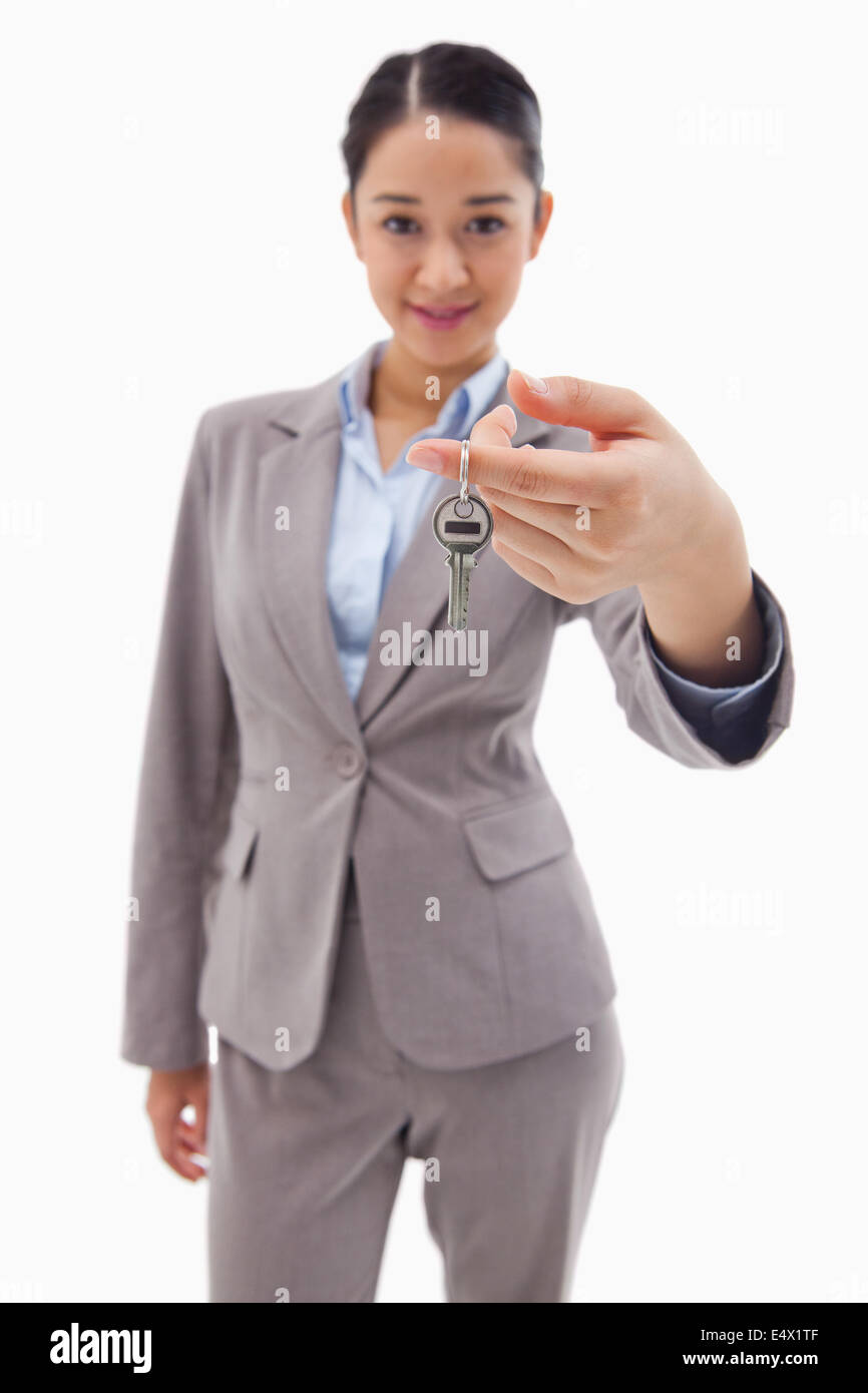 Happy owner holding key Cut Out Stock Images & Pictures - Alamy