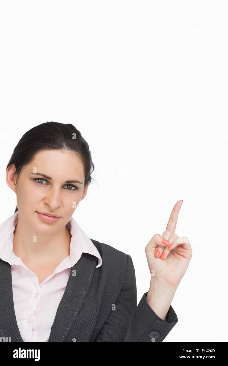 Brunette woman pointing up Stock Photo - Alamy