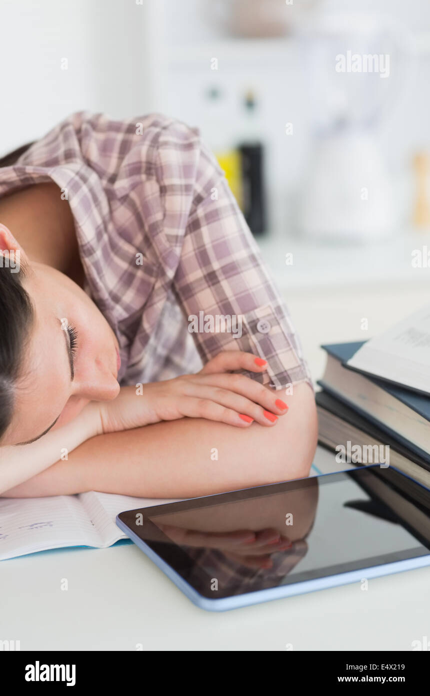 Woman leaning on the table and resting Stock Photo - Alamy