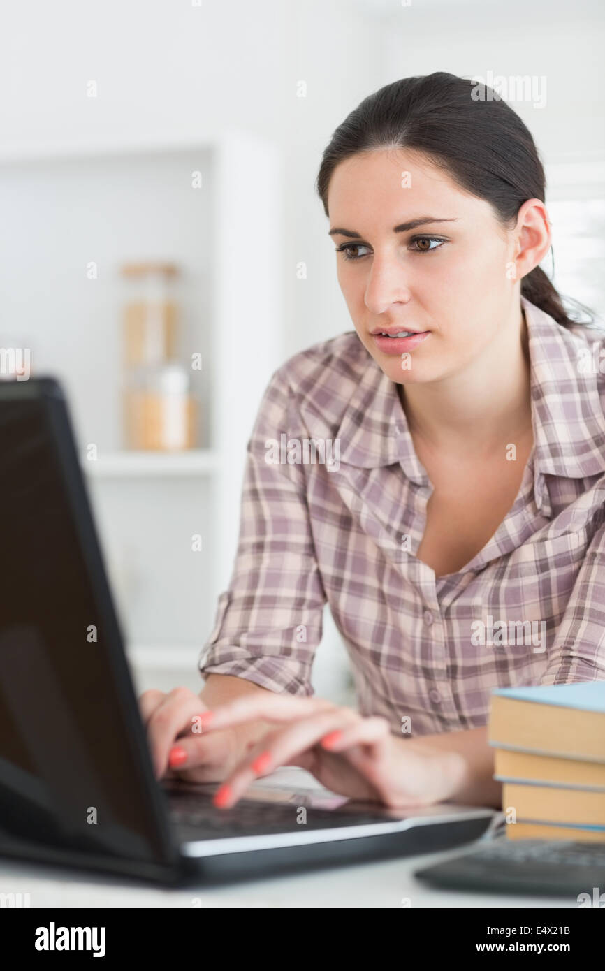 Woman typing on a computer Stock Photo - Alamy