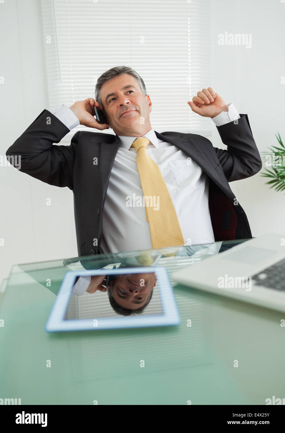 Business man phoning Stock Photo - Alamy