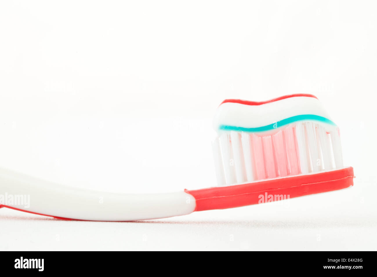 Red tube of toothpaste Cut Out Stock Images & Pictures - Alamy