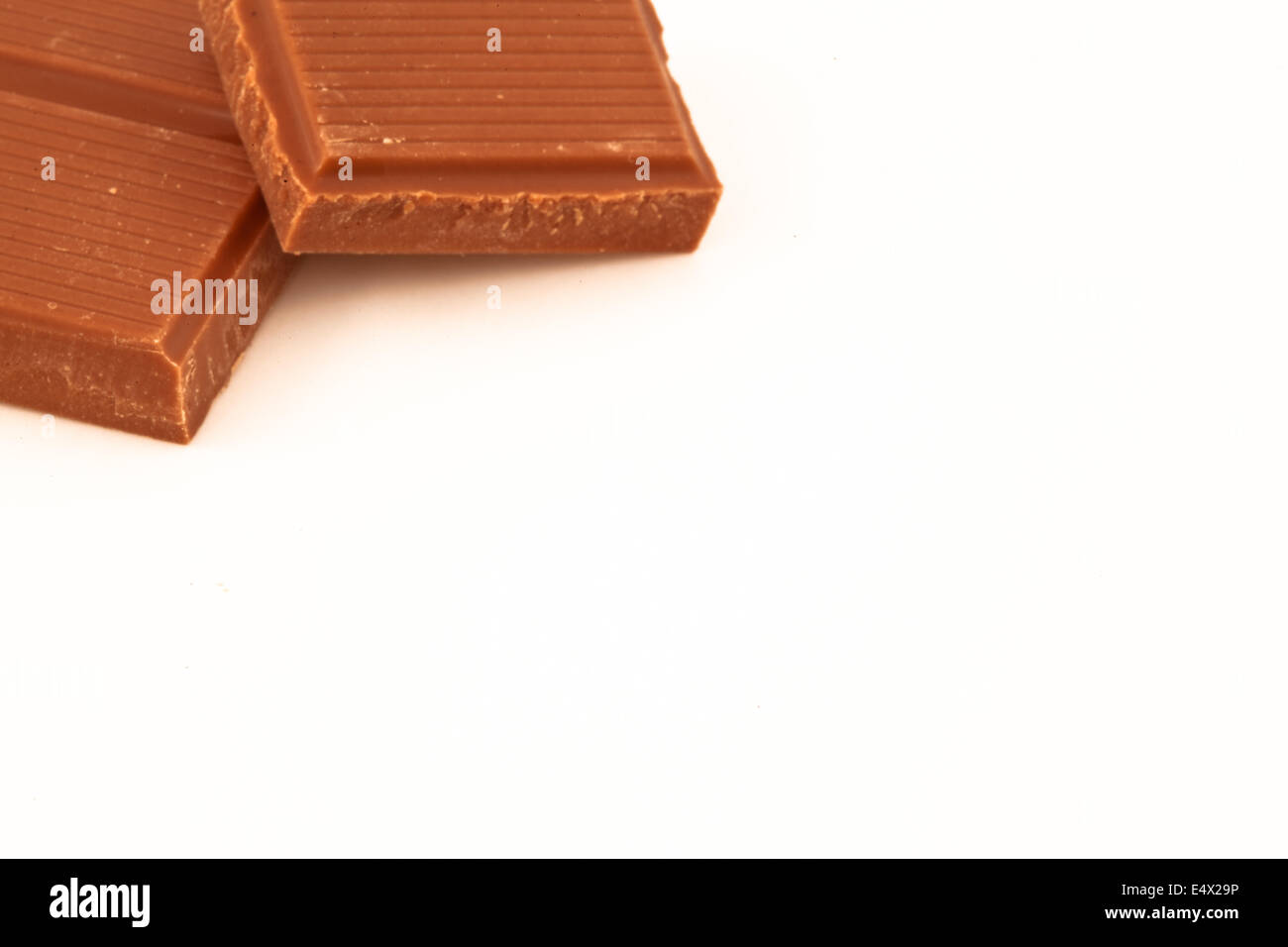 Two pieces of milk chocolate Stock Photo - Alamy