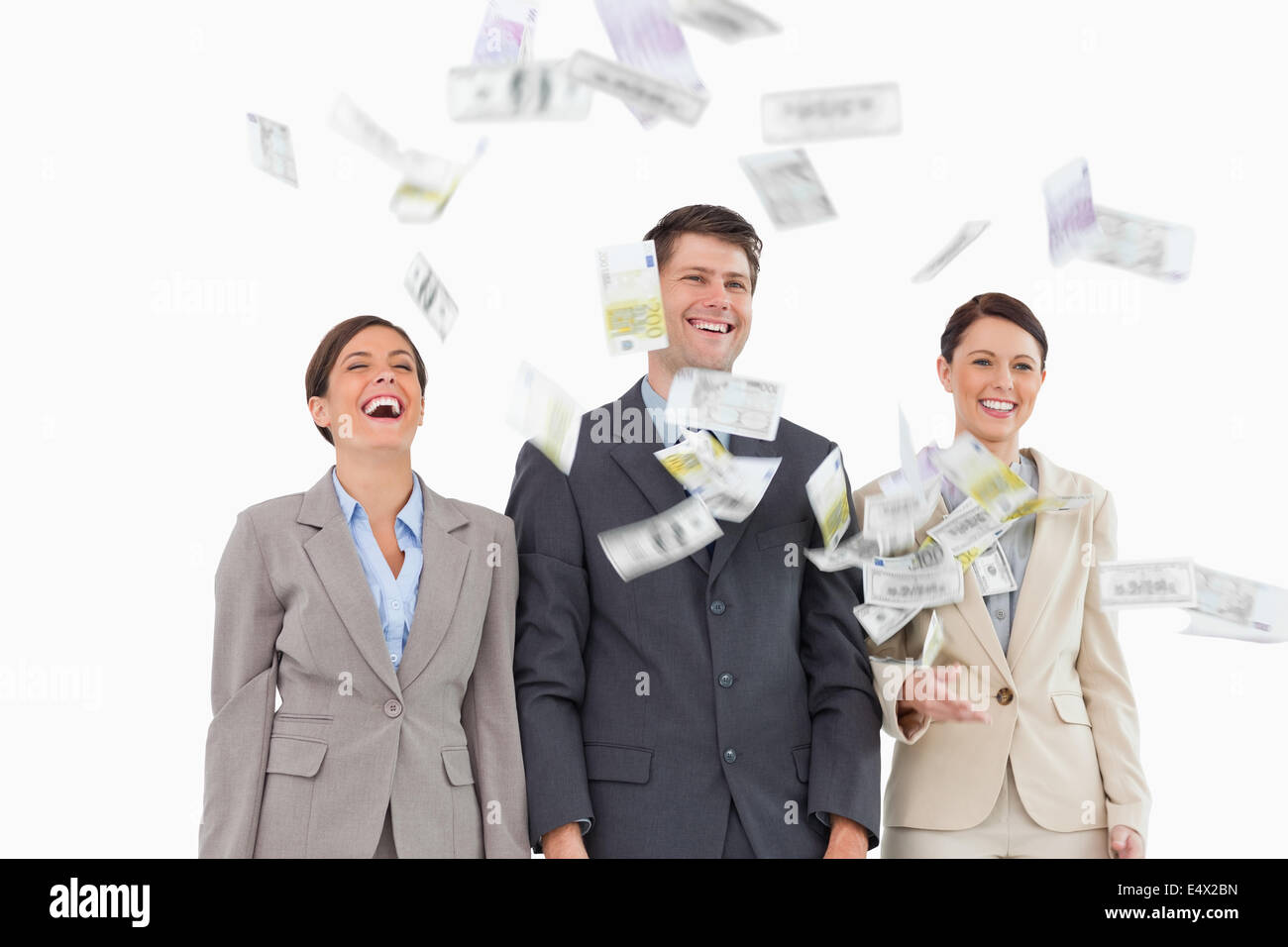 Money falling down on smiling businessteam Stock Photo - Alamy