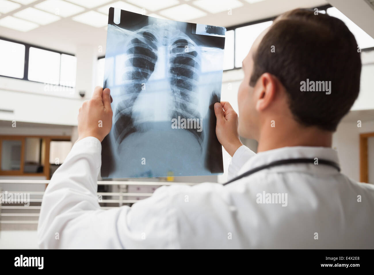 Doctor studying x-ray Stock Photo - Alamy