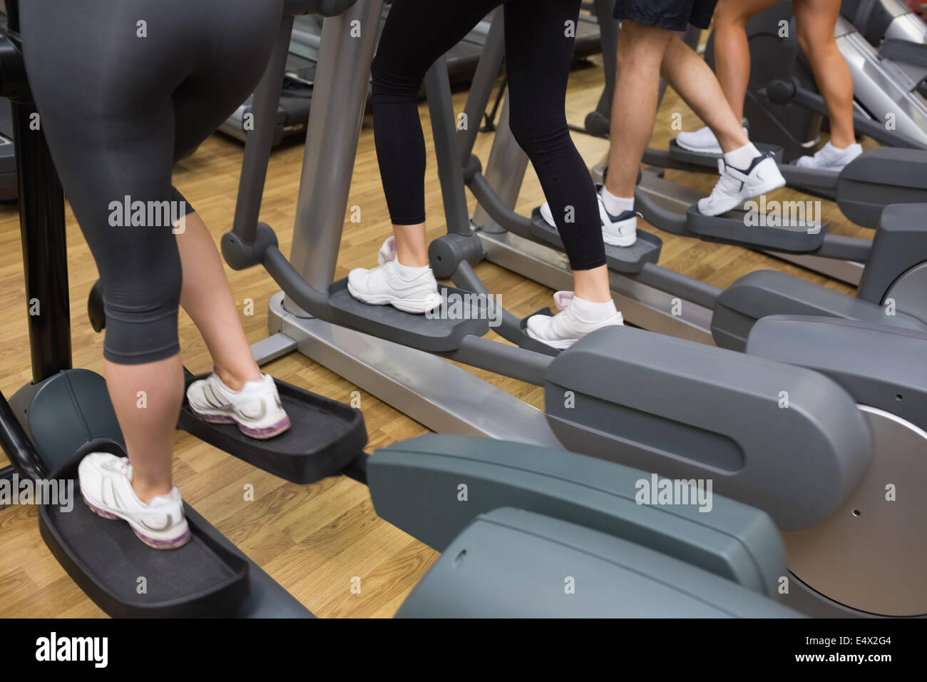 Four people stepping Stock Photo - Alamy