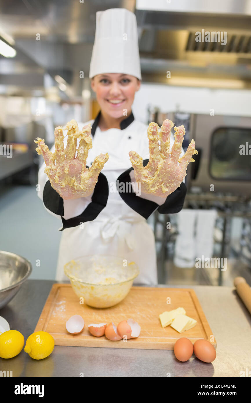 Baker showing her hands with dough Stock Photo - Alamy