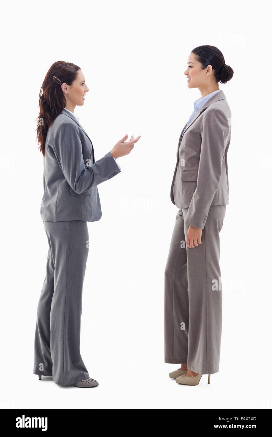 Two businesswomen talking face to face Stock Photo - Alamy