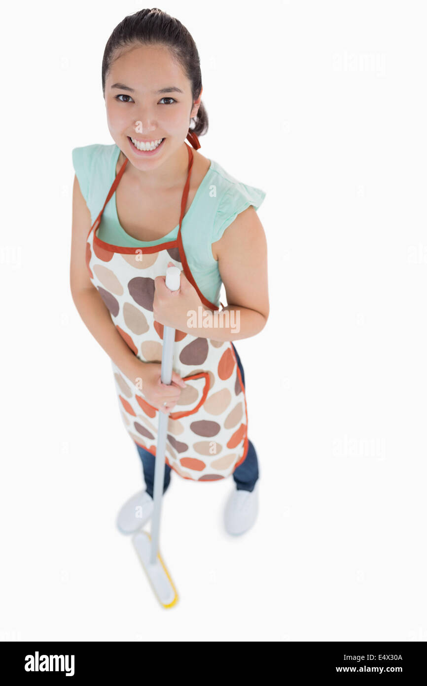 Young woman sweeping floor hi-res stock photography and images - Alamy