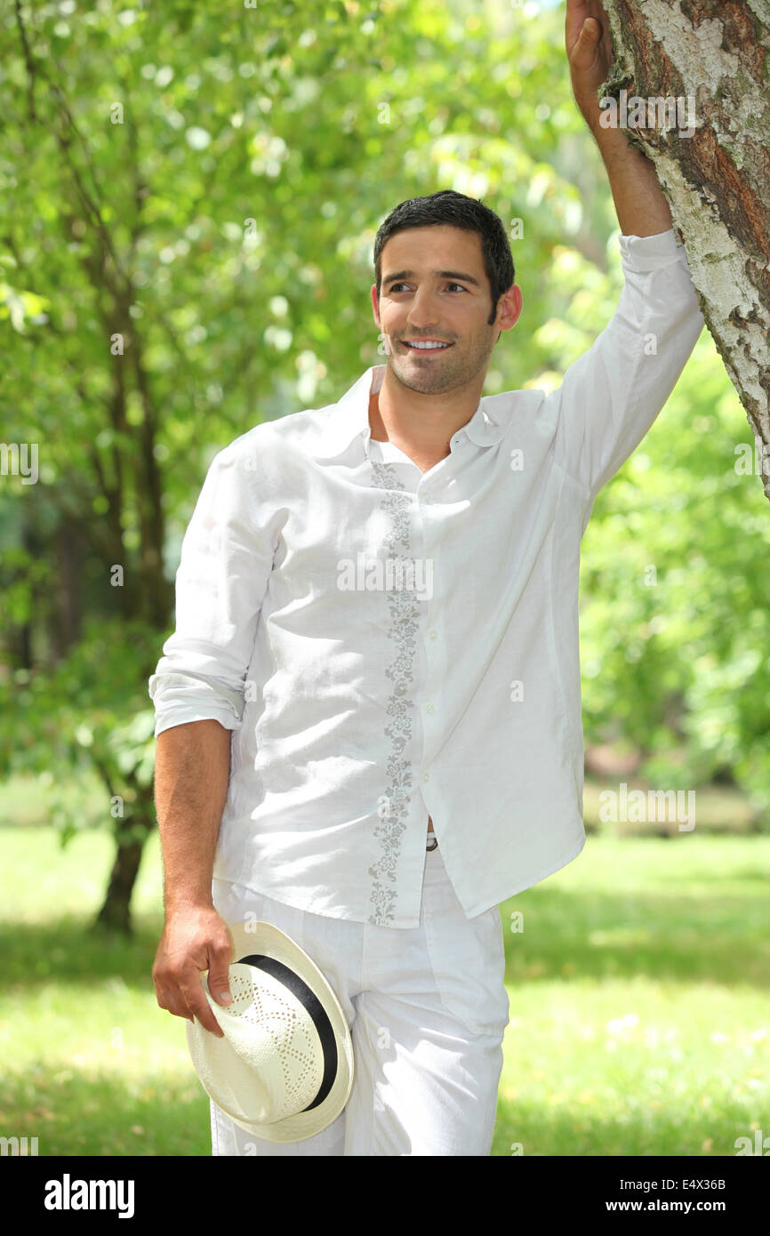 Pose Leaning Against Tree