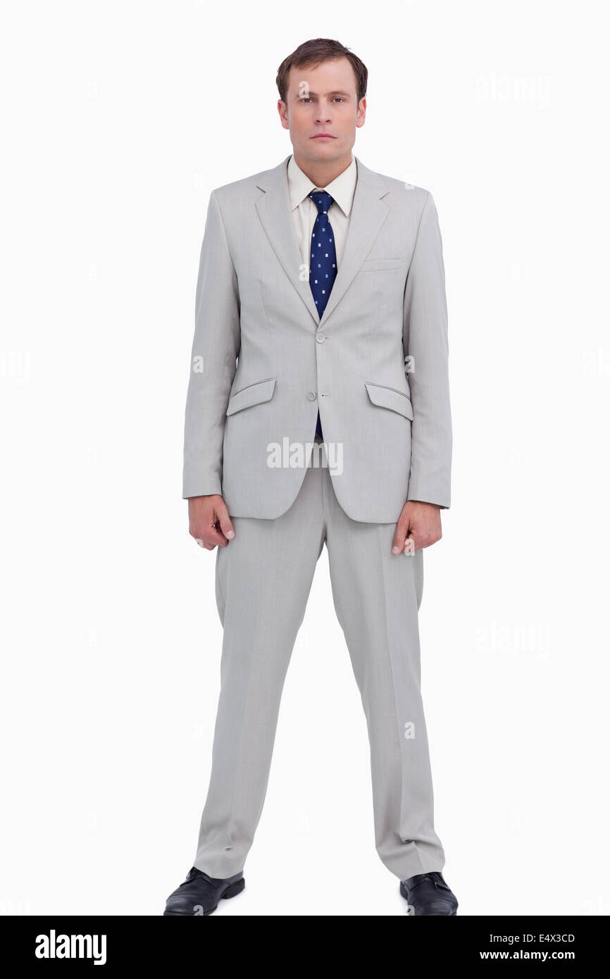 Serious businessman standing Stock Photo - Alamy