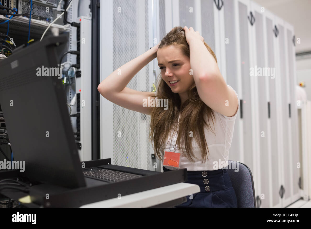 Stressed woman working on the server Stock Photo - Alamy