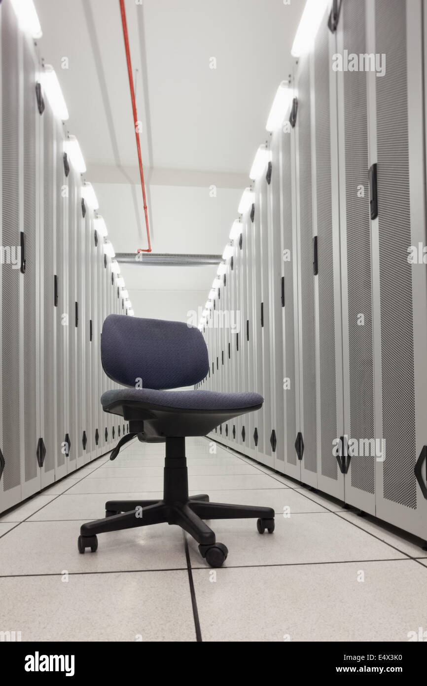 Chair in empty row of servers Stock Photo - Alamy