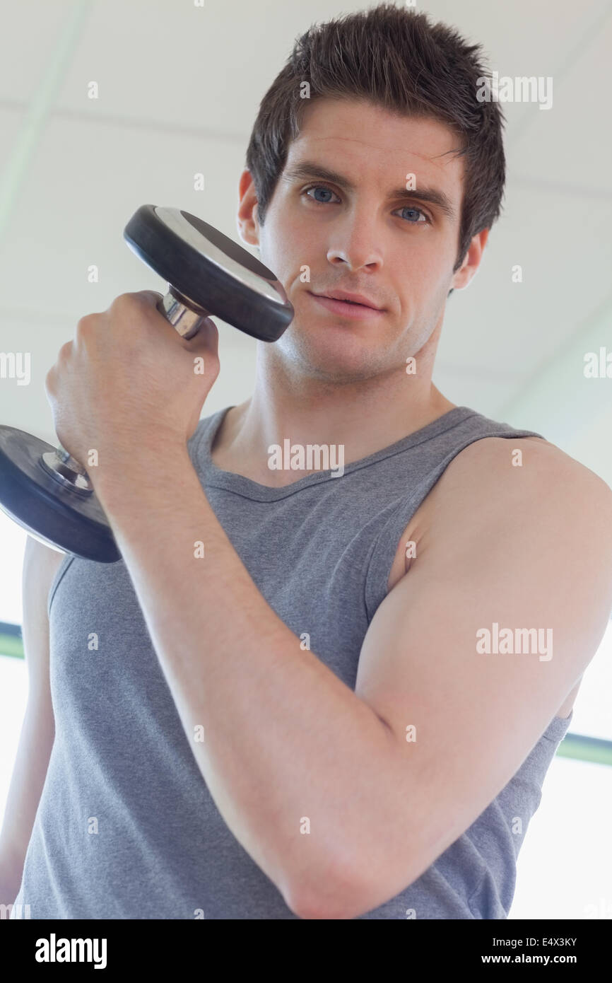 Man holding dumbbell Stock Photo - Alamy