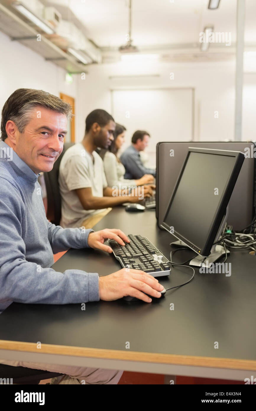 Joyful young university student using hi-res stock photography and ...