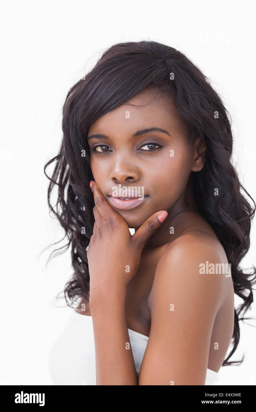 Woman with hand at chin Stock Photo - Alamy