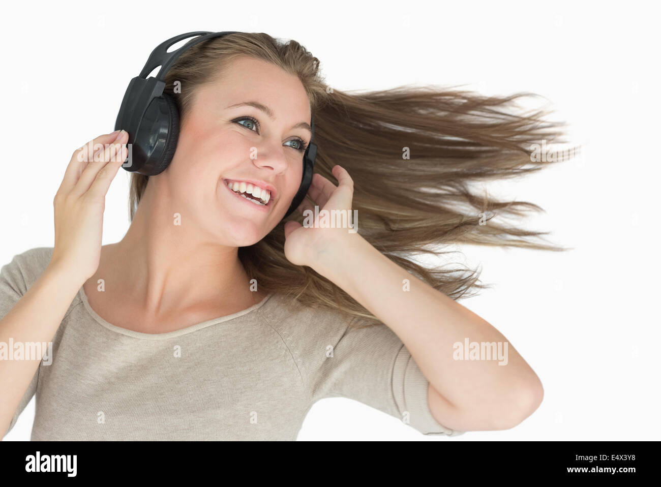 Smiling woman dancing with a headphone Stock Photo - Alamy