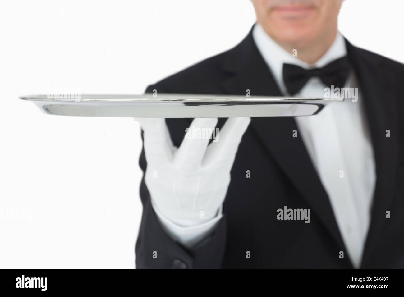 Waiter balancing silver tray Stock Photo - Alamy
