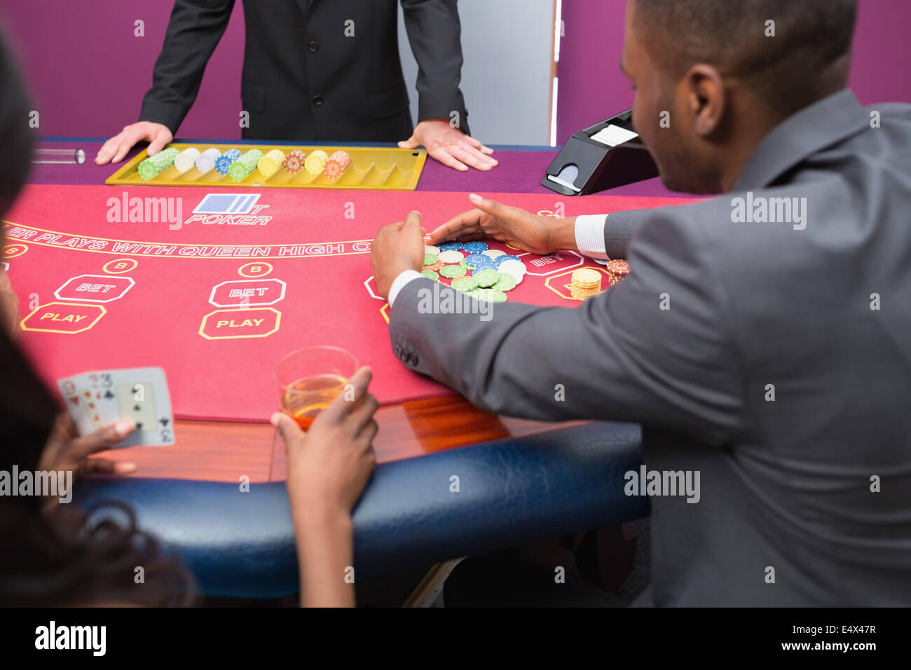 man-grabbing-chips-at-poker-table-stock-photo-alamy