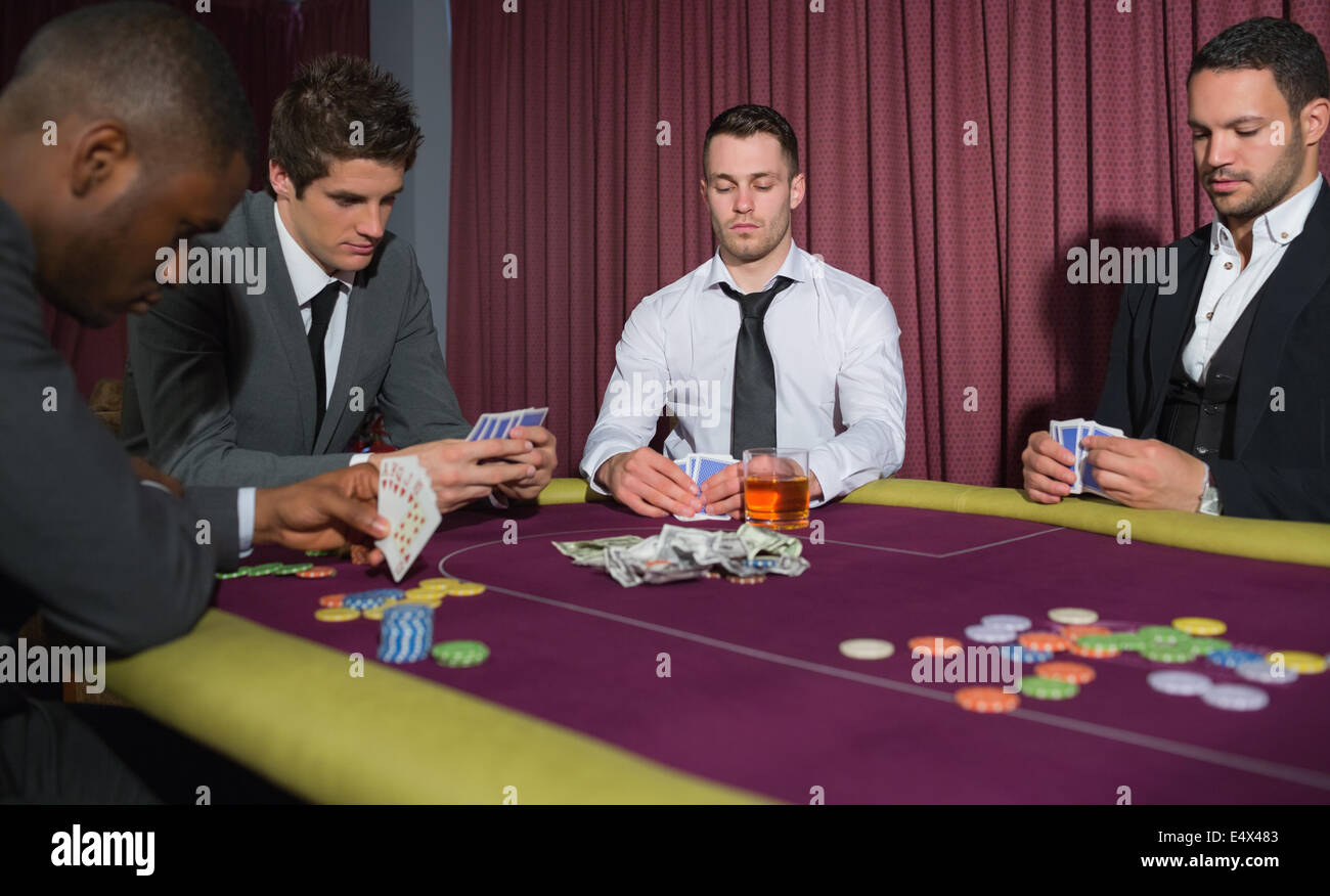 Suit men playing cards hi-res stock photography and images - Alamy