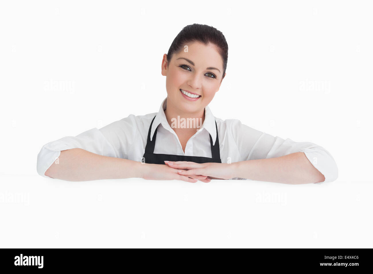 Smiling woman resting on her arms Stock Photo - Alamy